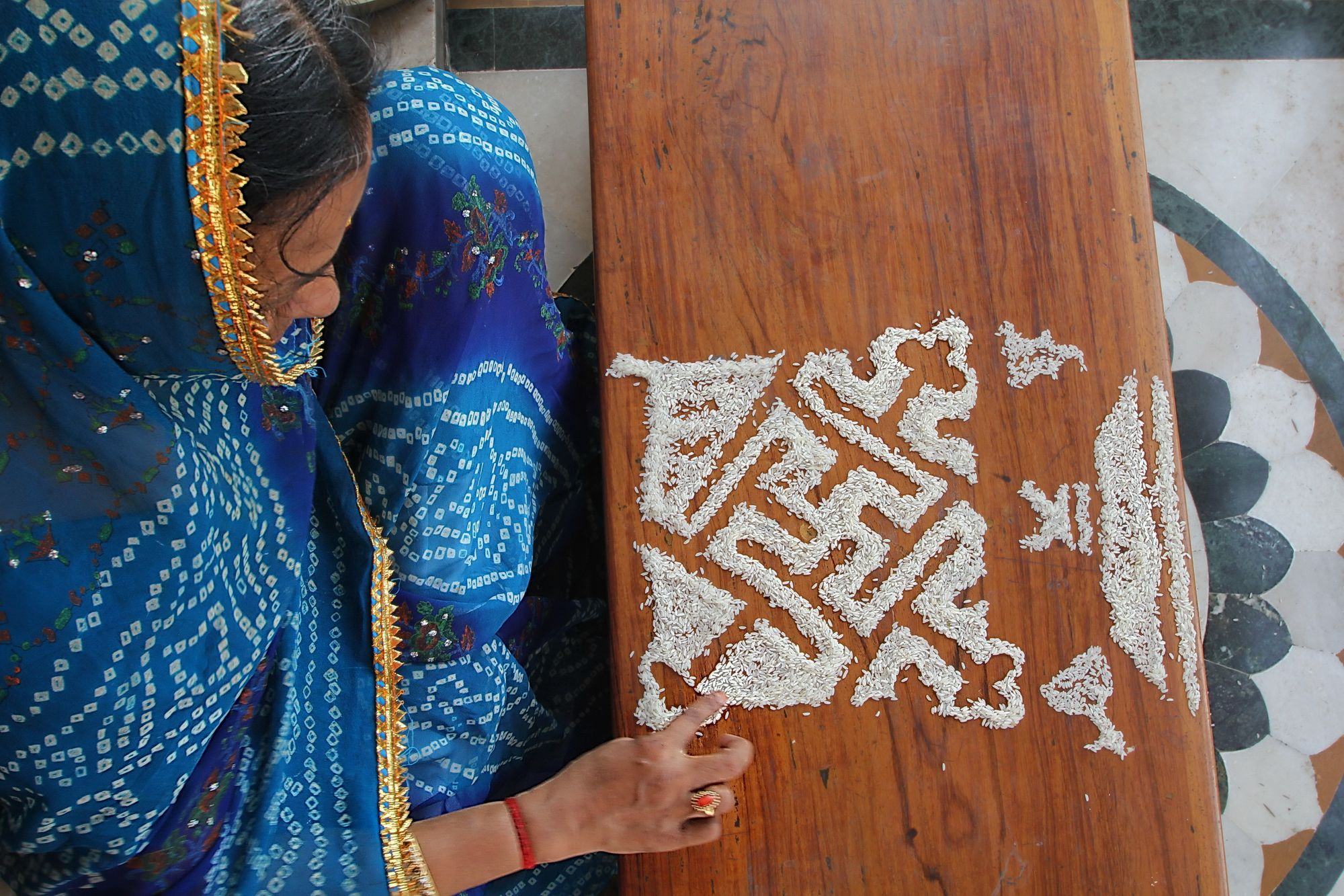 Maavu kolam, the wet rice flour kolam